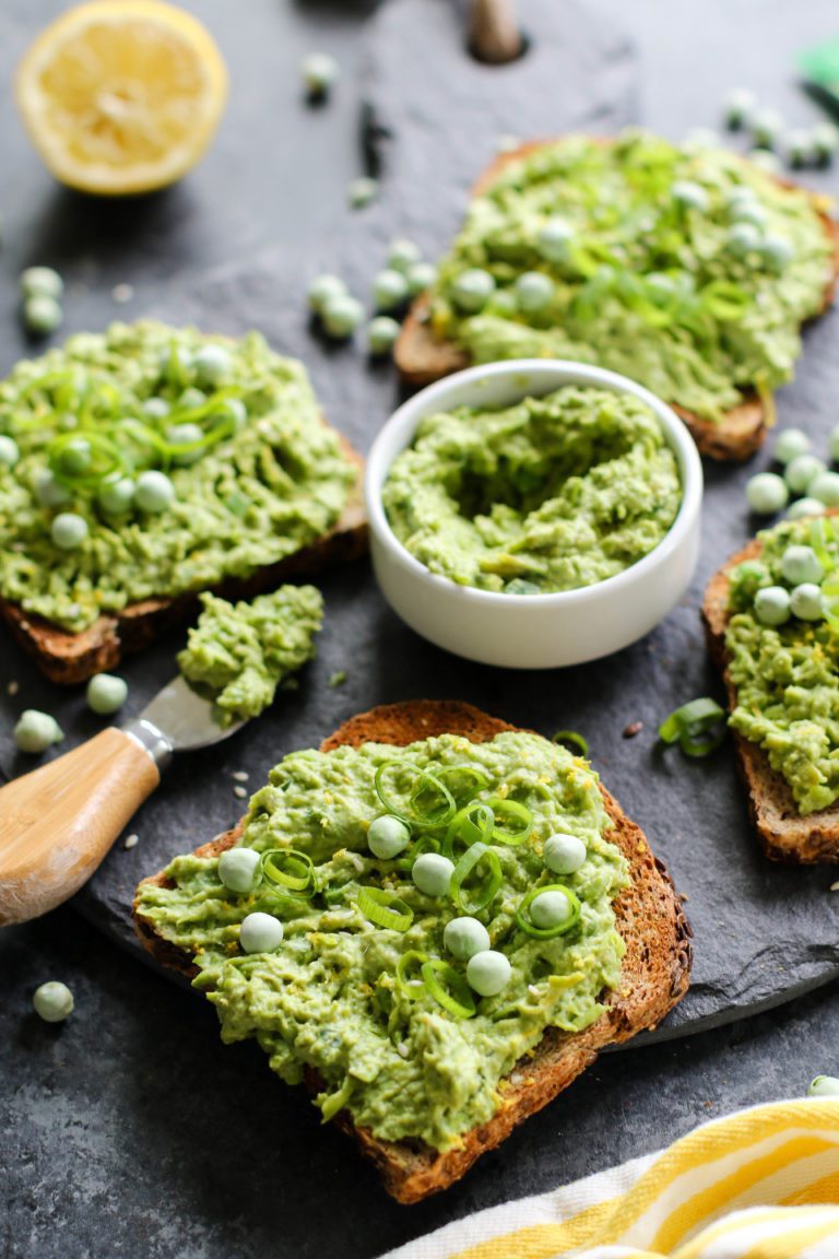 Lemon-y Smashed Pea Toasts by Flora & Vino with herbs and garnishes