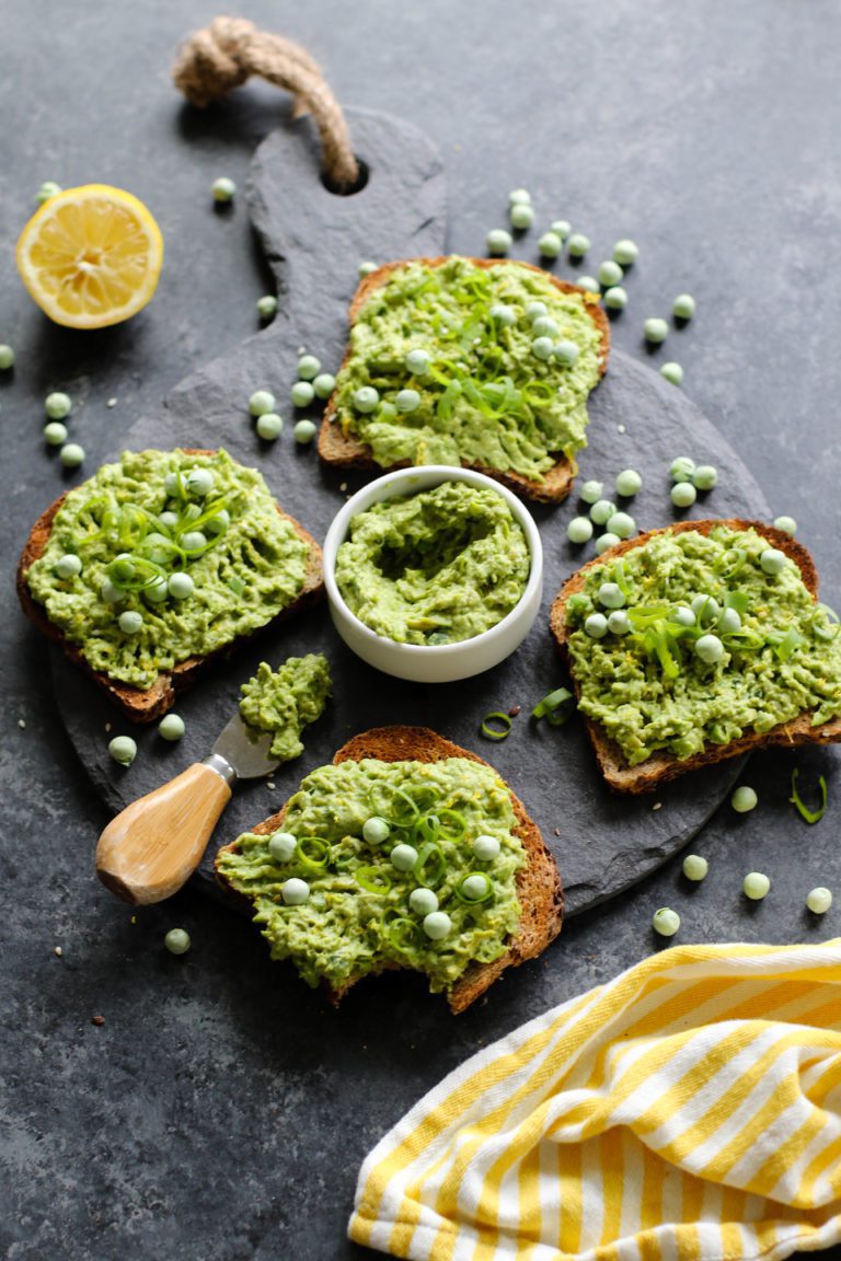 Lemon-y Smashed Pea Toasts by Flora & Vino with herbs and garnishes